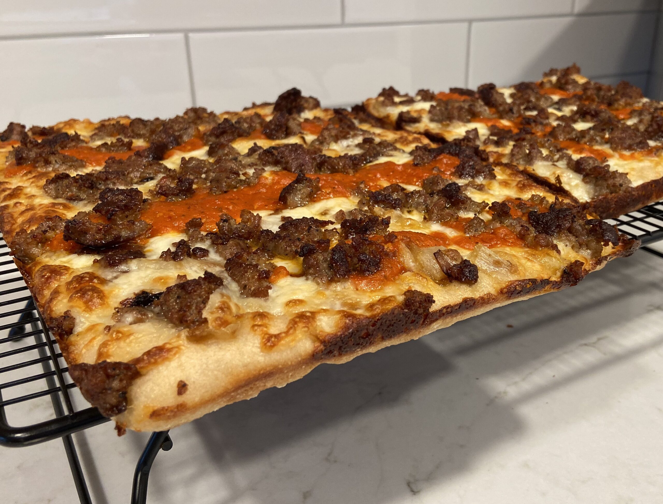 detroit-style pizza with sausage, caramelized onions, & roasted garlic ...
